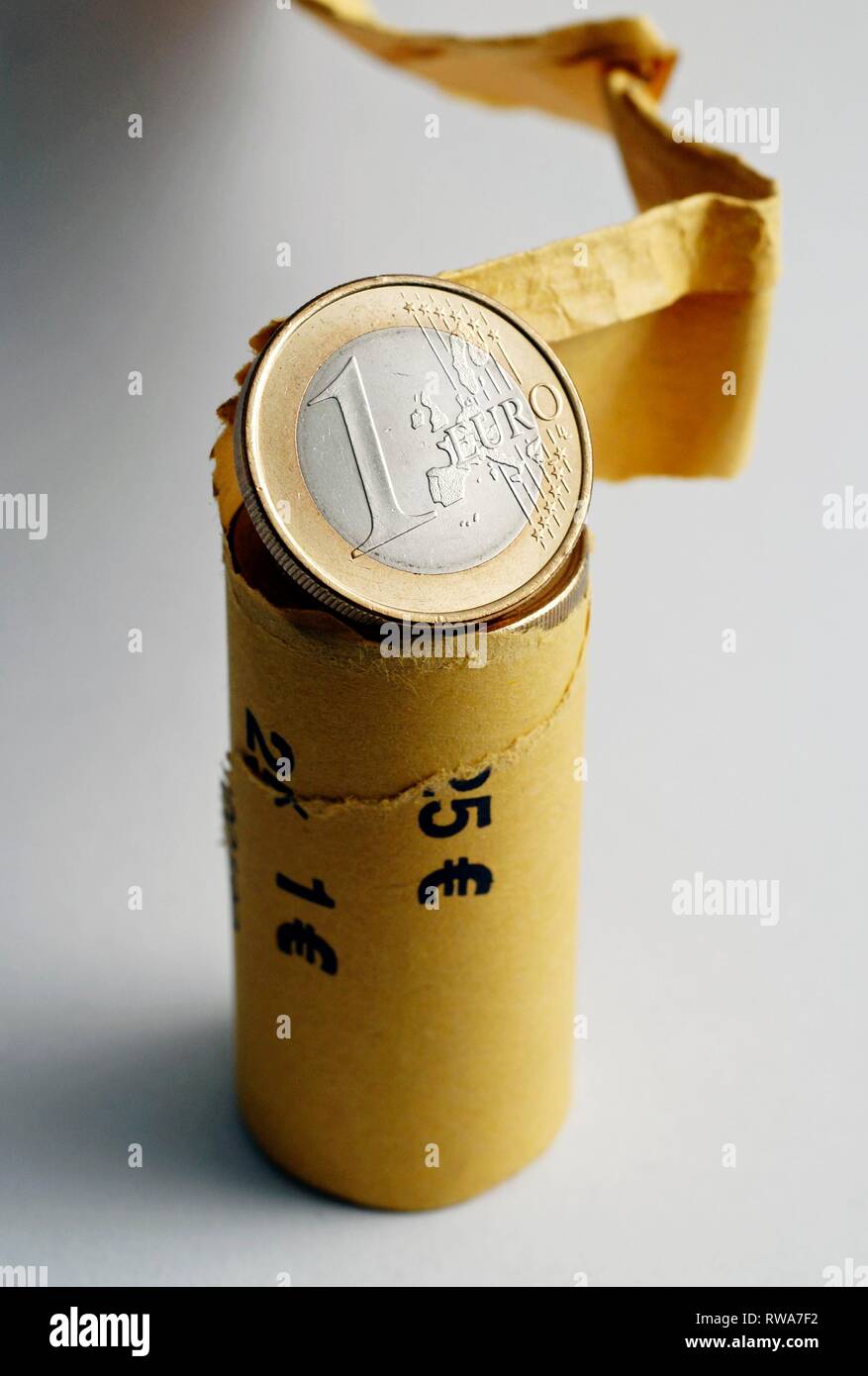 Roll with 1 euro coins, Germany Stock Photo - Alamy