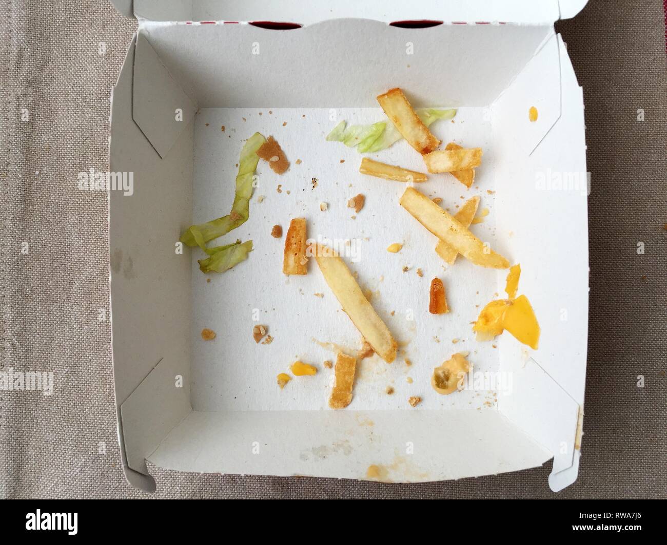 Empty cardboard box, remains of French fries, Germany Stock Photo - Alamy