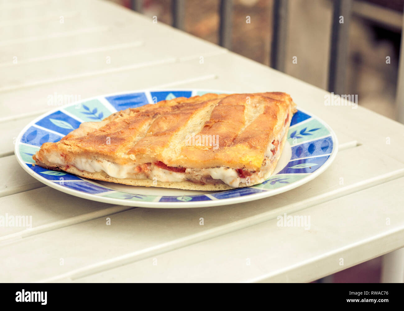 Fried calzone pizza with ham, mozzarella, tomatoes from bakery shop of ...
