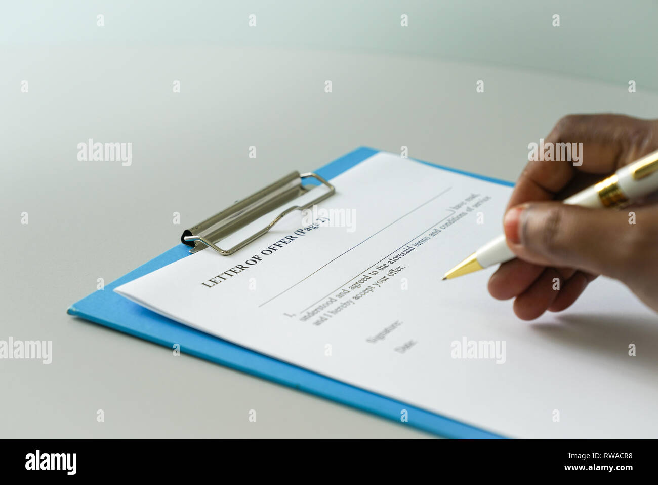 Letter of offer to be signed by potential employee Stock Photo - Alamy