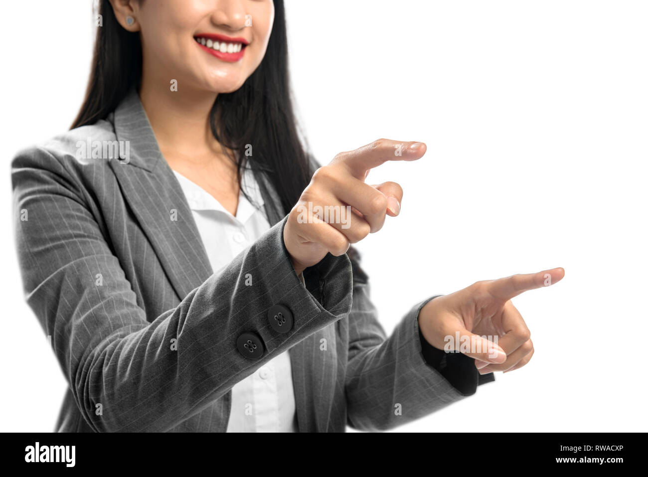 Smiling asian business woman touch something with her both finger hands ...