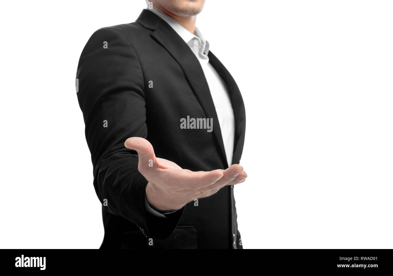 Businessman in suit standing with open palm for offer shake hands and ...