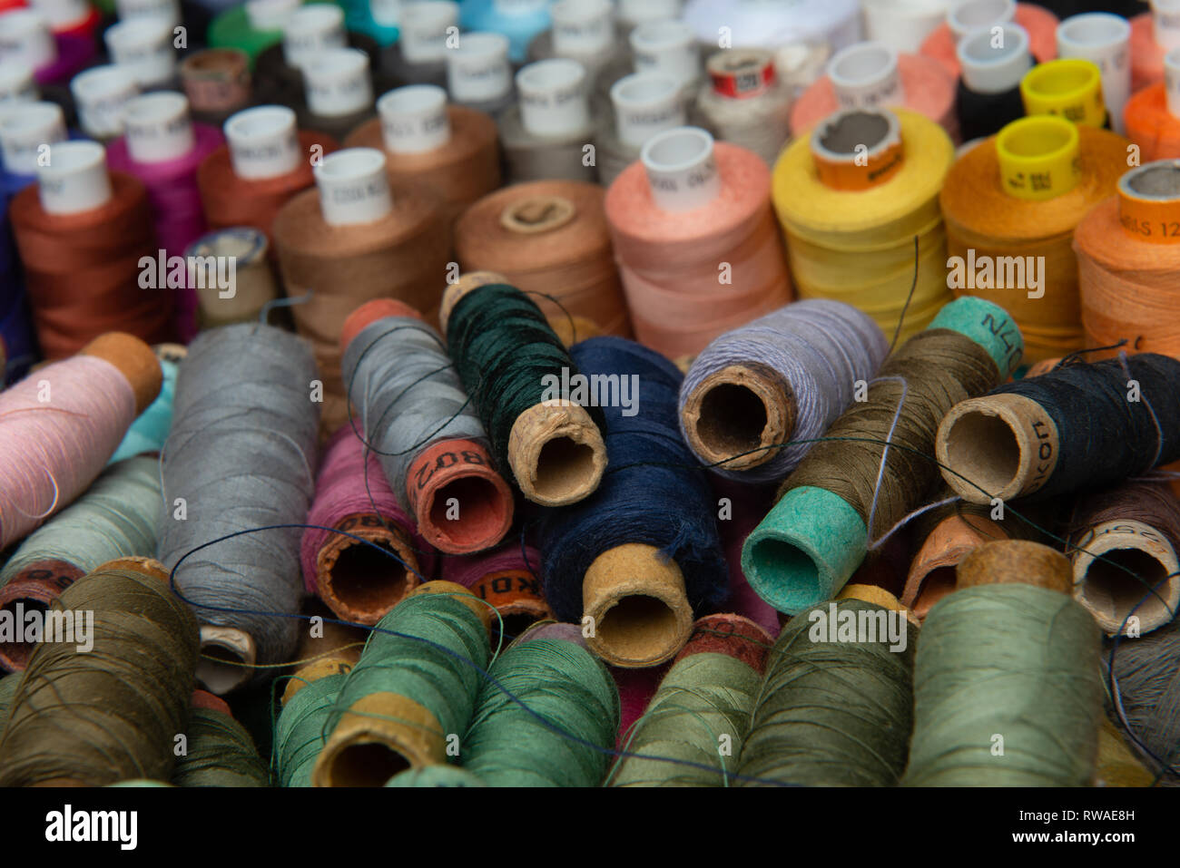 group of multicolored threads top view Stock Photo - Alamy