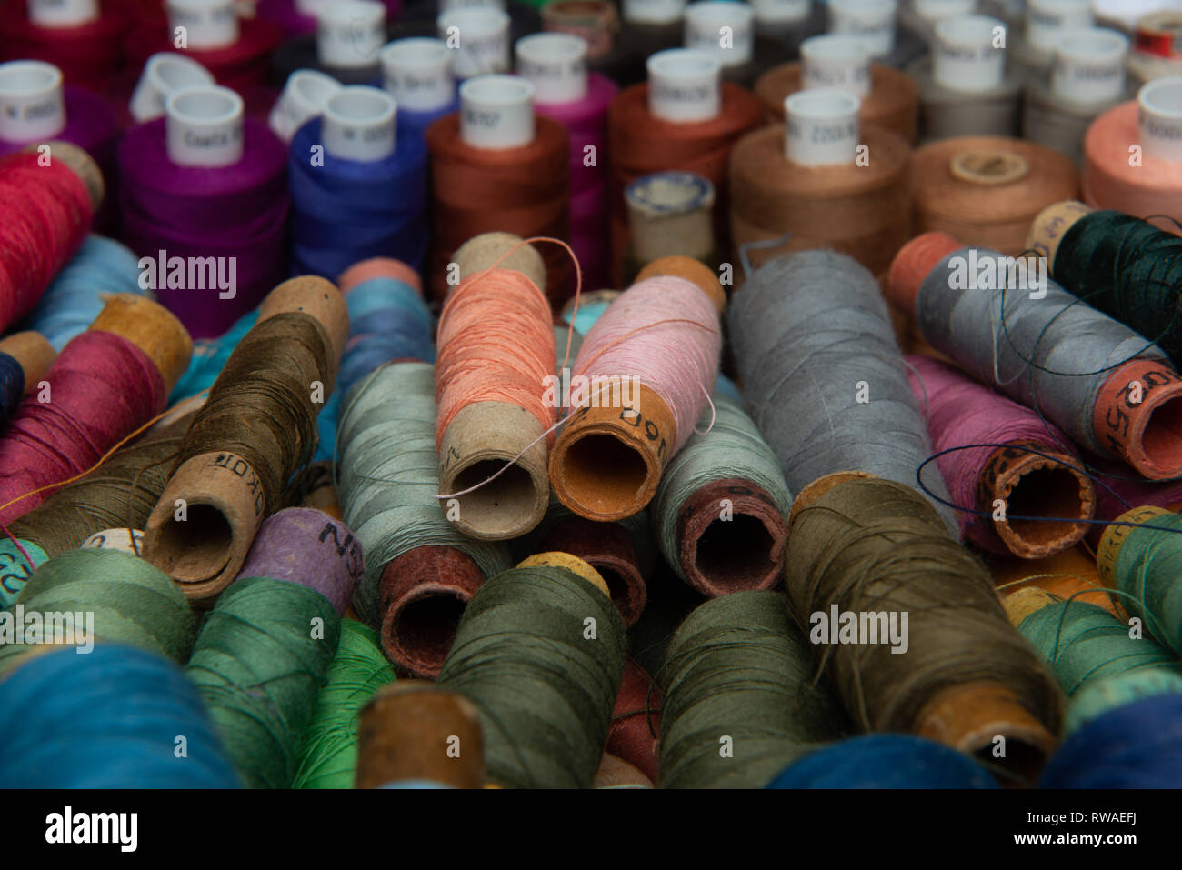 group of multicolored threads top view Stock Photo - Alamy