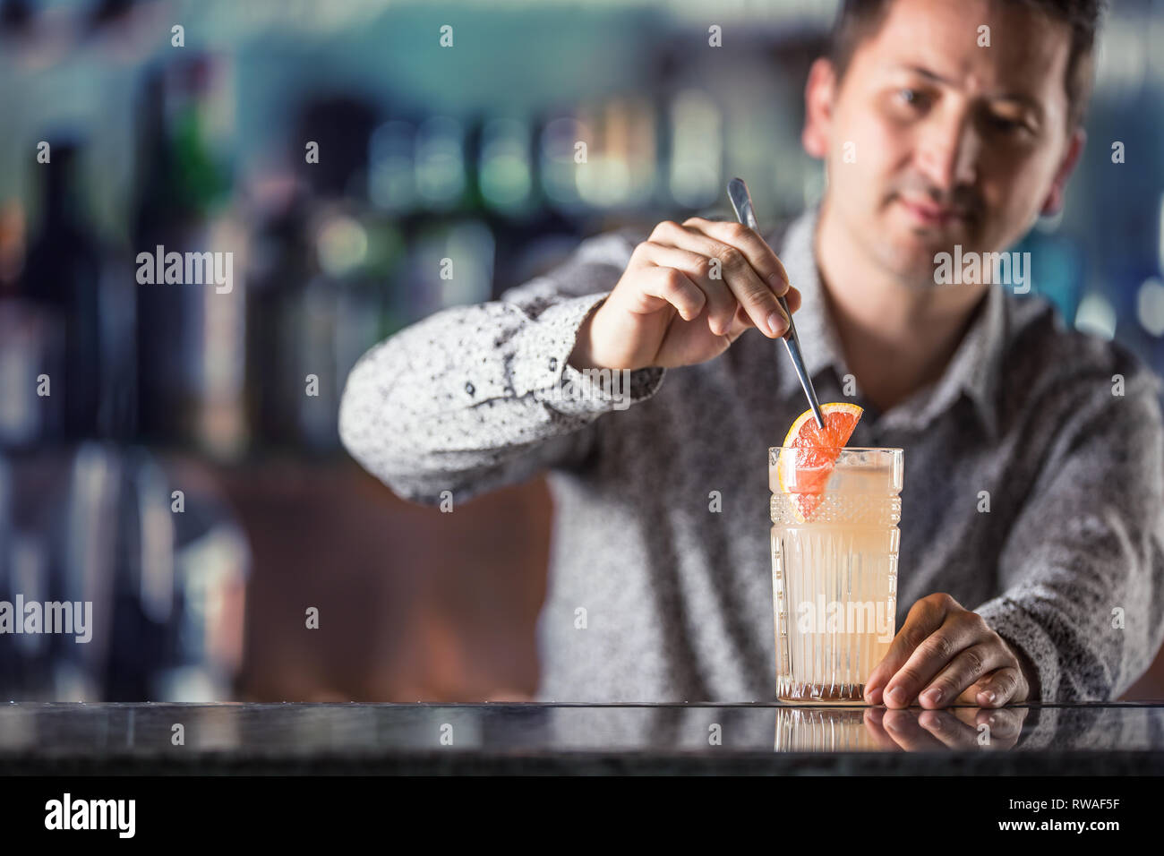 Professional barman making alcoholic cocktail drink paloma Stock Photo ...