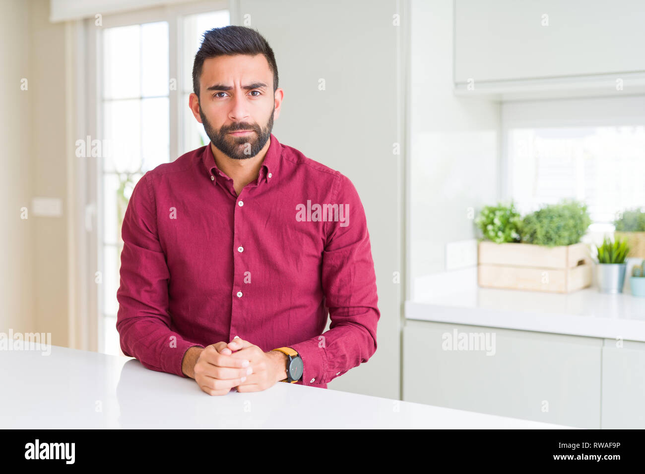 Handsome hispanic business man depressed and worry for distress, crying ...