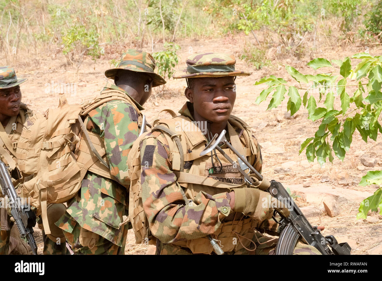 A Nigerian Soldier Takes Cover While On Training Exercises In Burkina