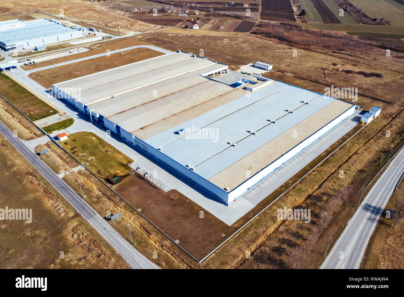 Aerial view of industrial estate surrounded by cultivated field in ...