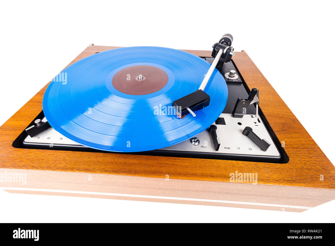 Vintage turntable with a blue vinyl isolated on white. Wooden plinth ...