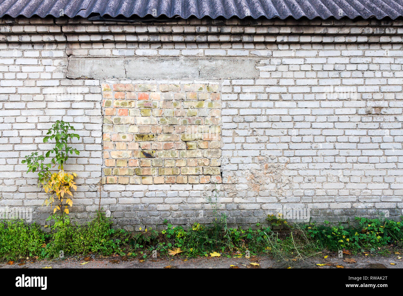 Old gungy white brick wall with bricked up window Stock Photo - Alamy