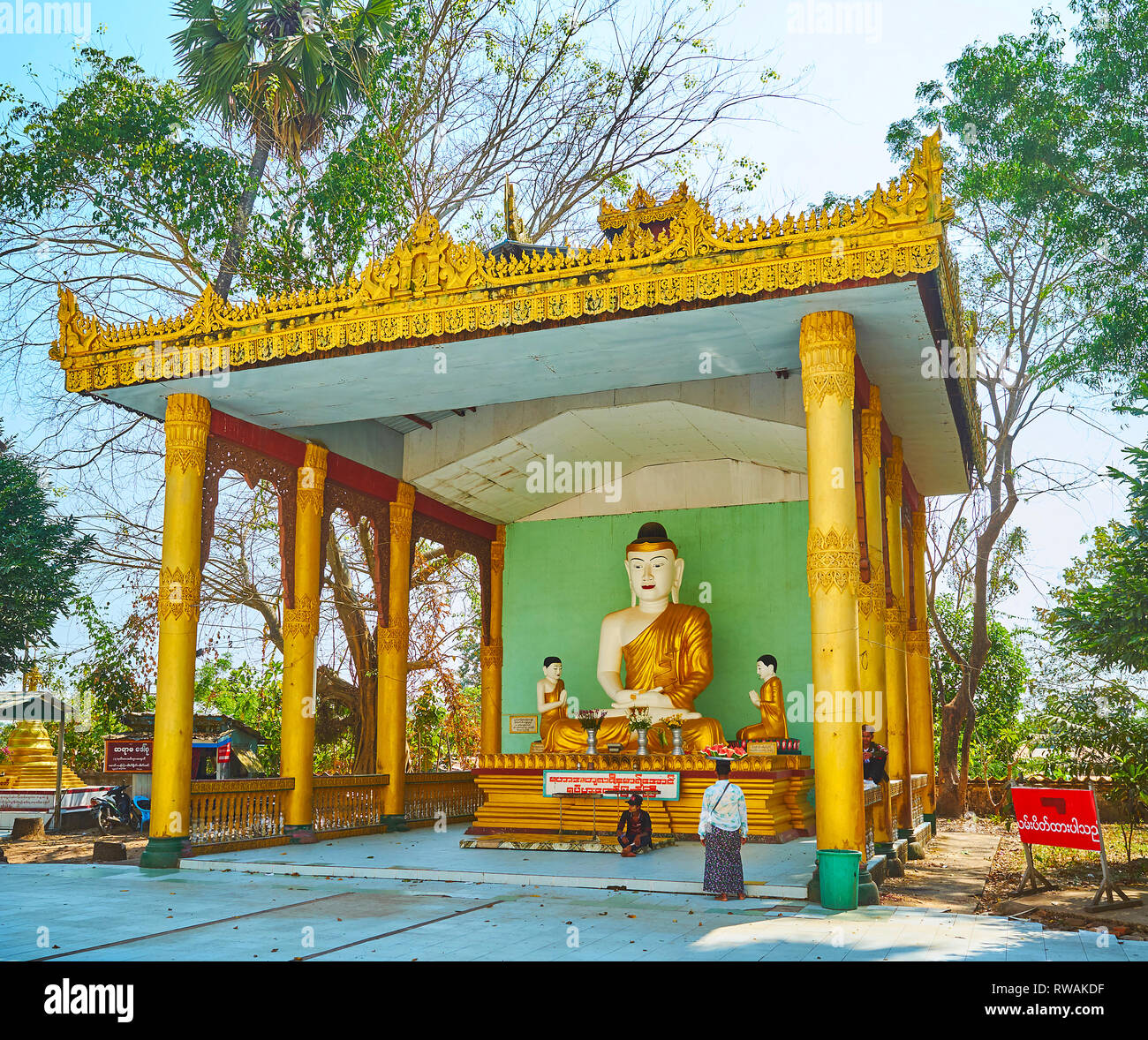 BAGO, MYANMAR - FEBRUARY 15, 2018: Veranda with statue of Meditating ...