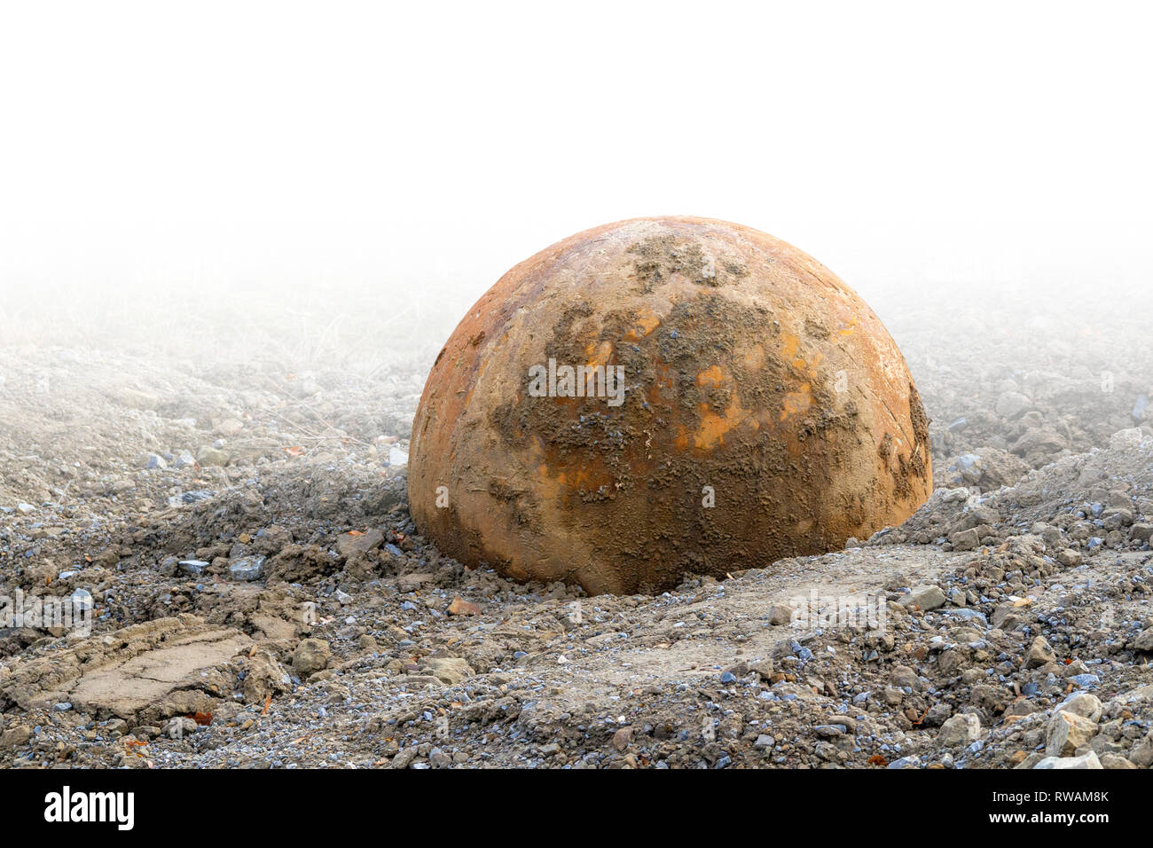 big rusty metal ball in gradient gravel back Stock Photo - Alamy