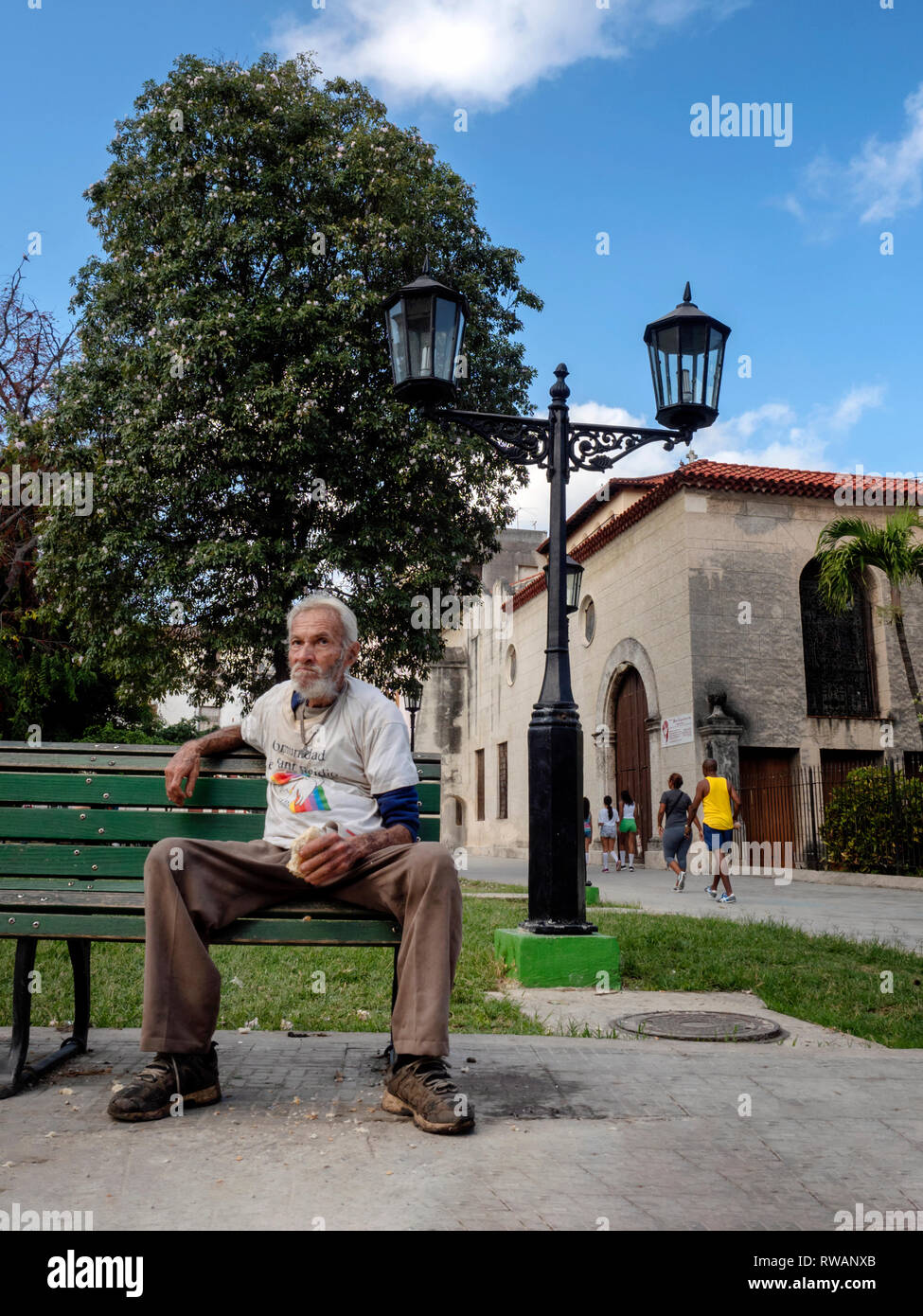 Cuban male sits down to a meagre lunch in the streets of central Havana ...