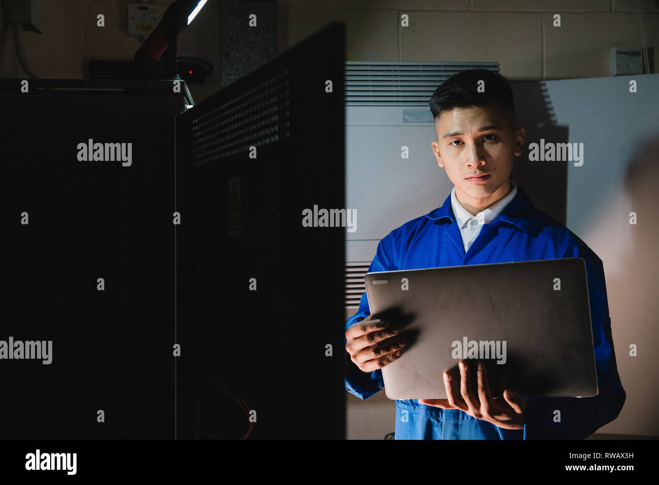 Asian young man plug in hi-res stock photography and images - Alamy