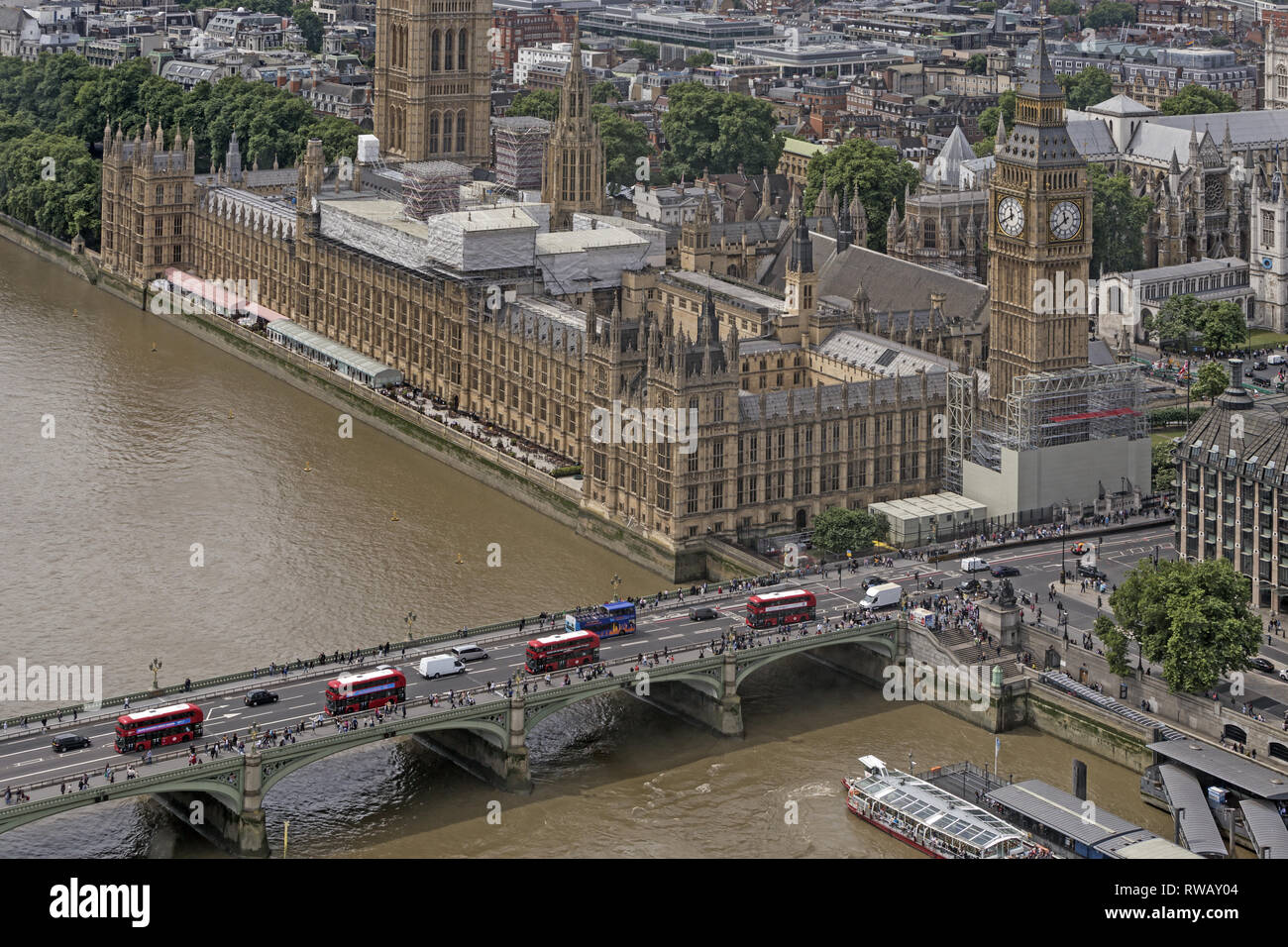 Aerial view of Westminster bridge with red double deckers, Westminster ...