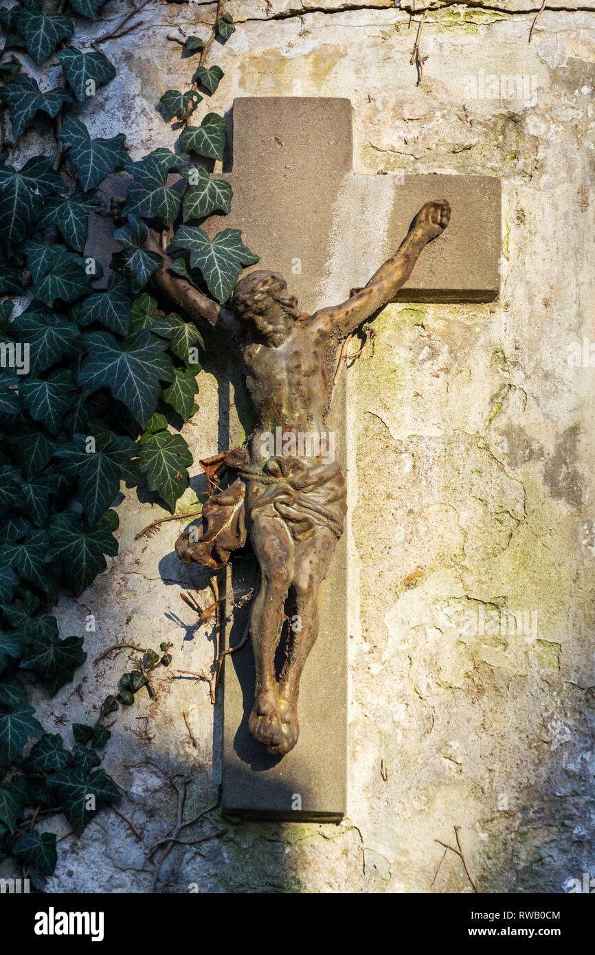 Beautiful rusty Jesus Christ crucifixion statue during sunset partly ...