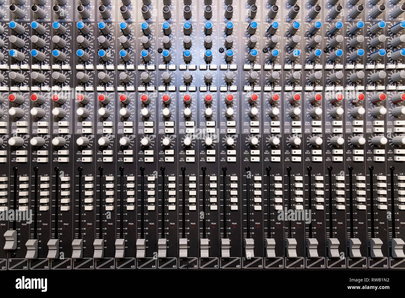 Abstract view of Professional audio mixing console with faders and ...
