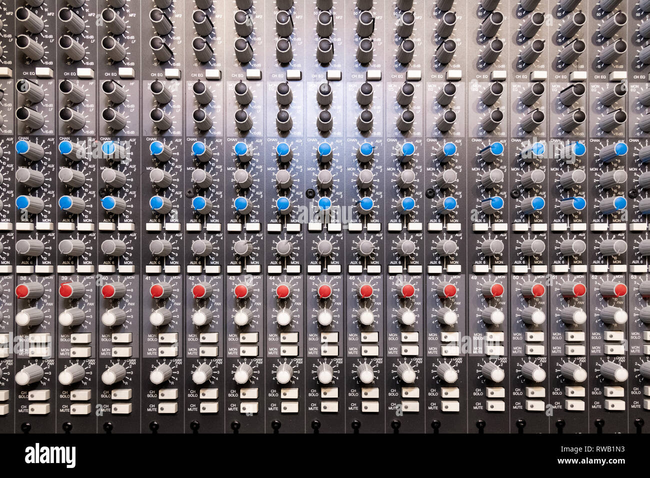Abstract view of Professional audio mixing console with faders and ...