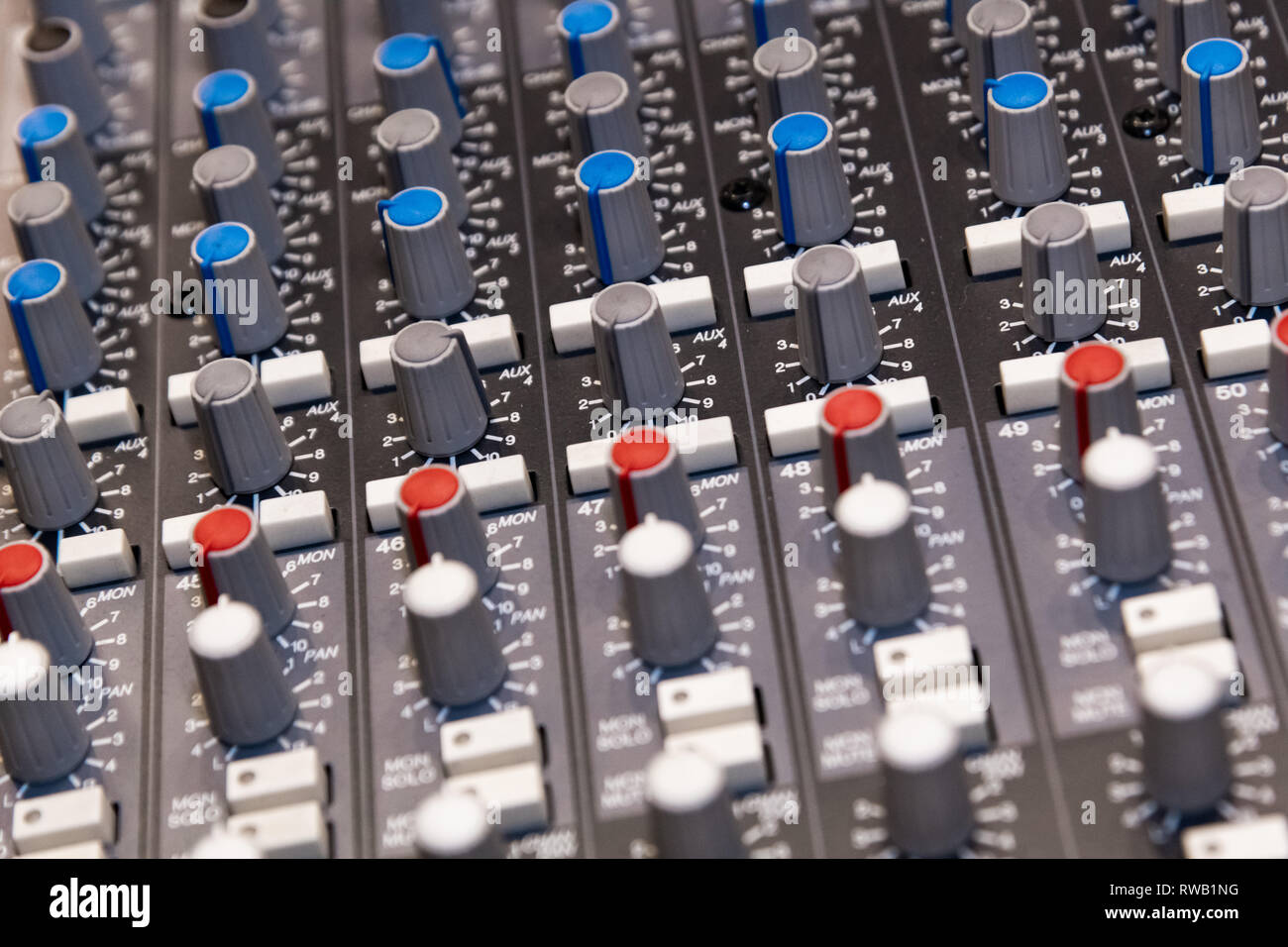 Abstract view of Professional audio mixing console with faders and ...