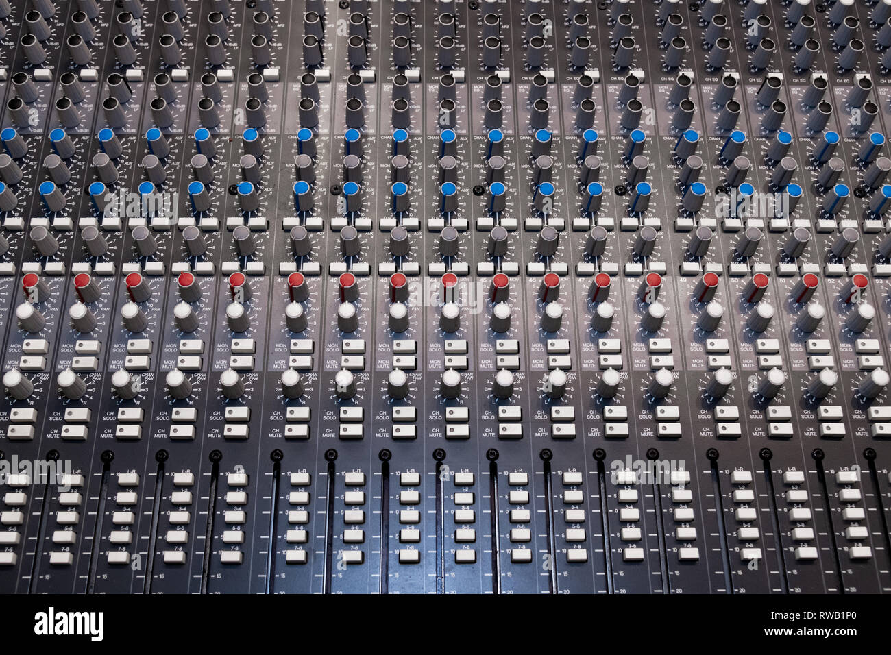 Abstract view of Professional audio mixing console with faders and ...