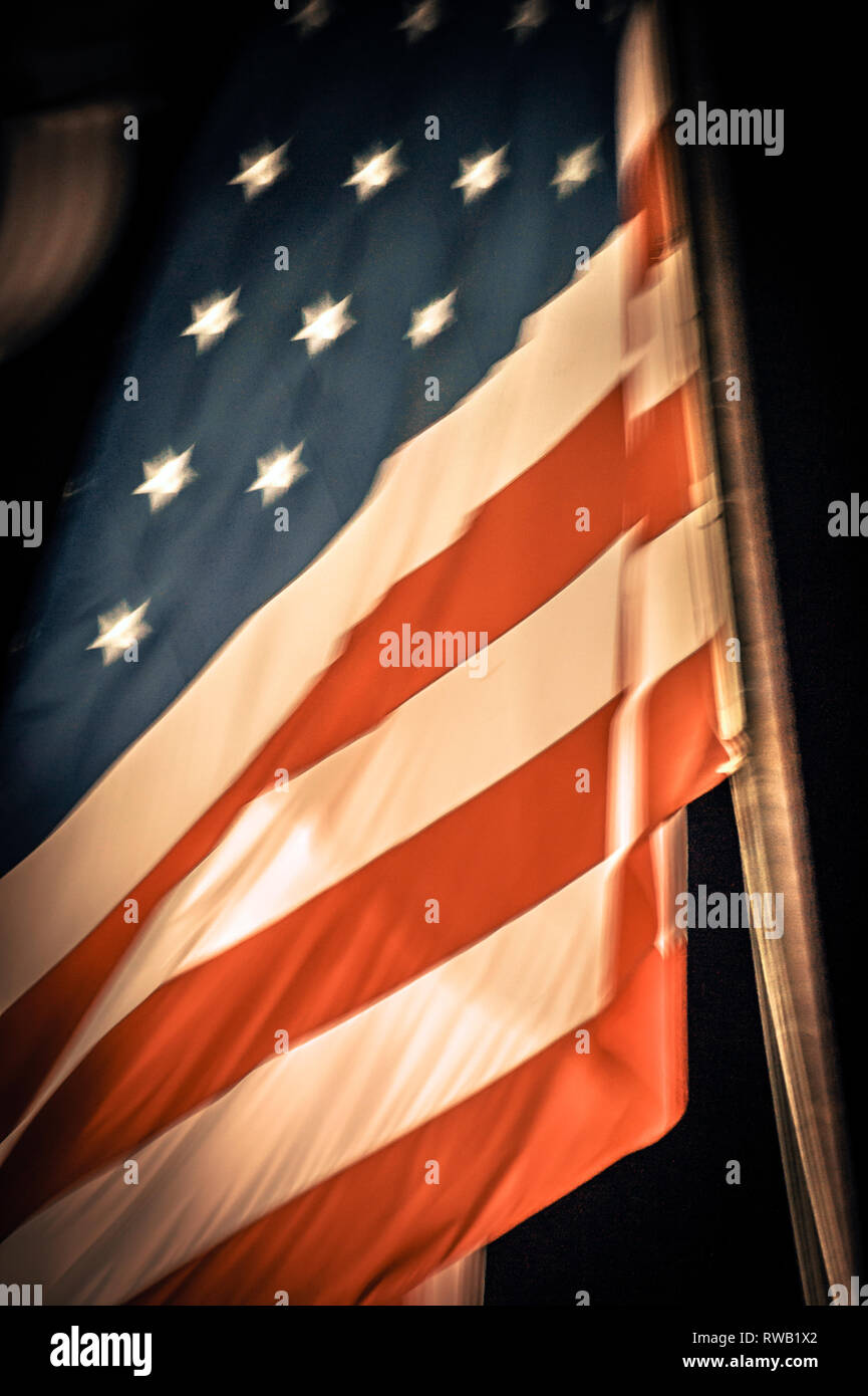 American flag waving on a flag post Stock Photo - Alamy