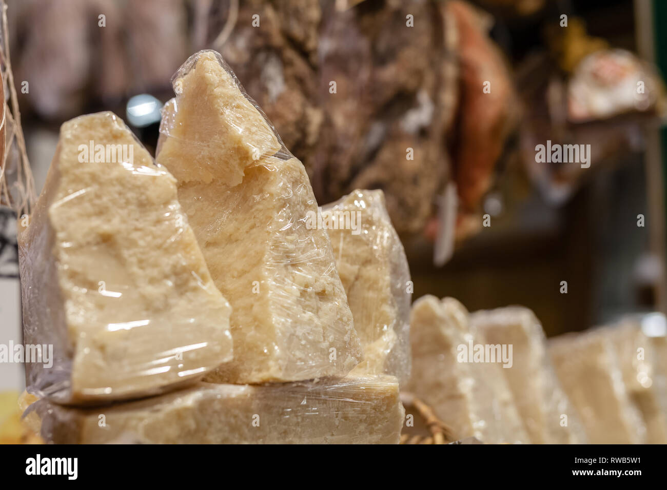 chunks of parmesan cheese on the counter Stock Photo - Alamy