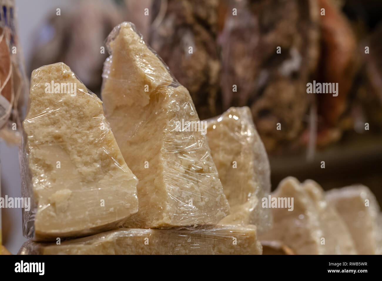 chunks of parmesan cheese on the counter Stock Photo - Alamy
