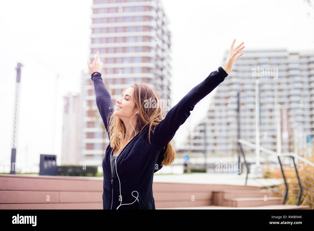 Woman arms up winner outdoors hi-res stock photography and images - Alamy