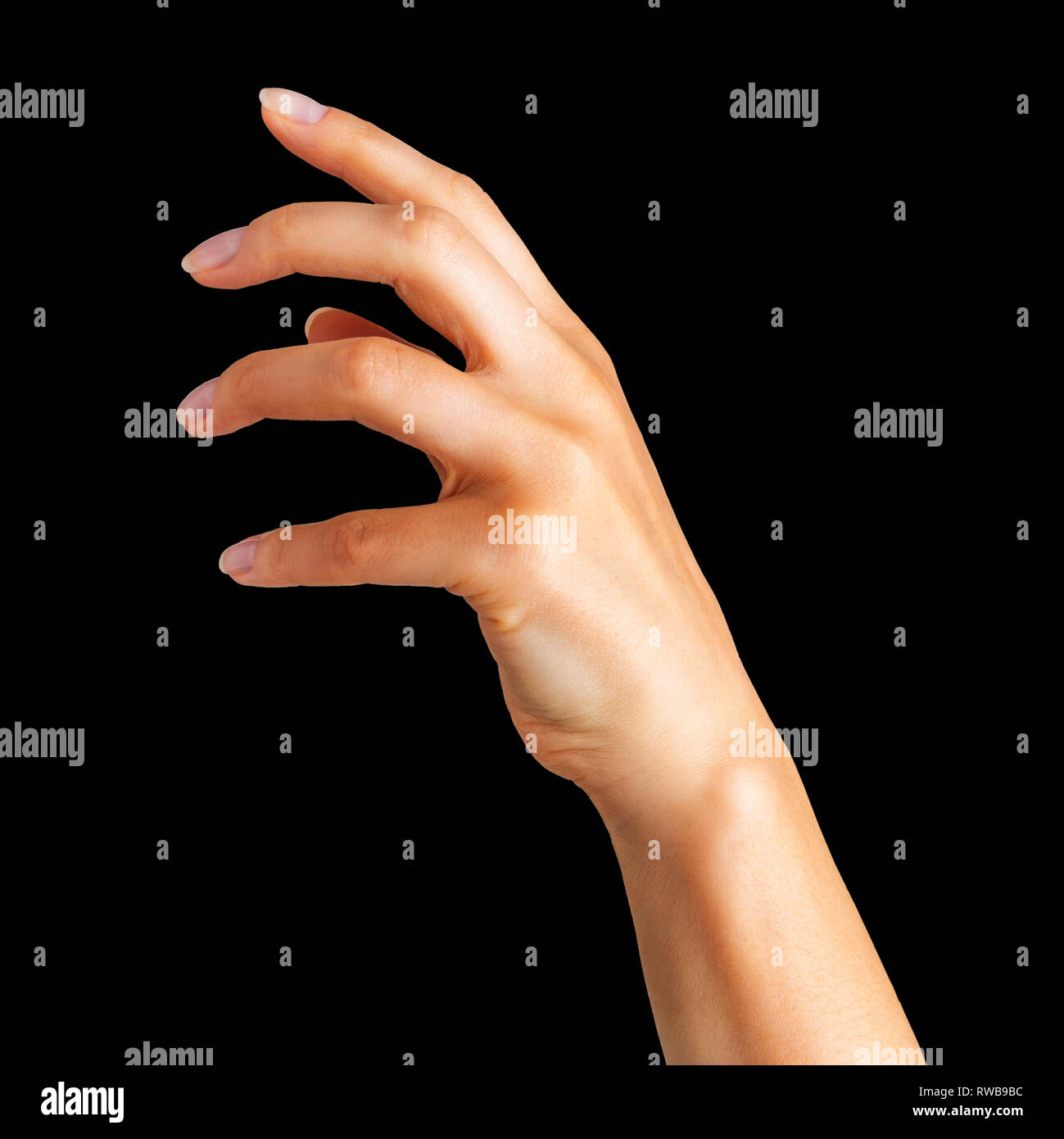 Woman hand with crooked fingers showing magic trick or holding ball ...