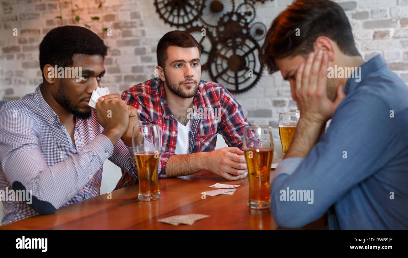 Three men play cards hi-res stock photography and images - Alamy