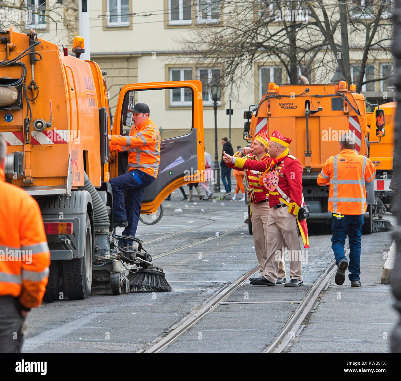 street cleaning workers and vehicles in the city Germany Wurzburg. the ...