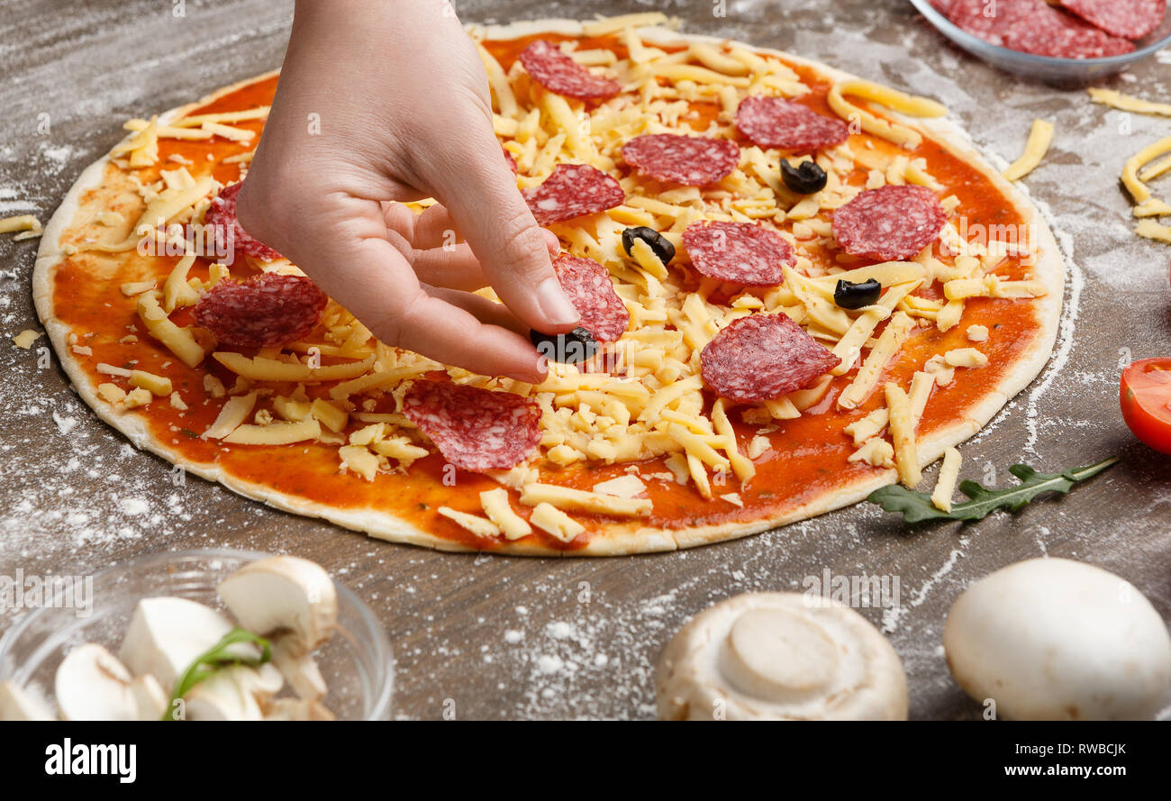Adding cheese pizza hi-res stock photography and images - Alamy