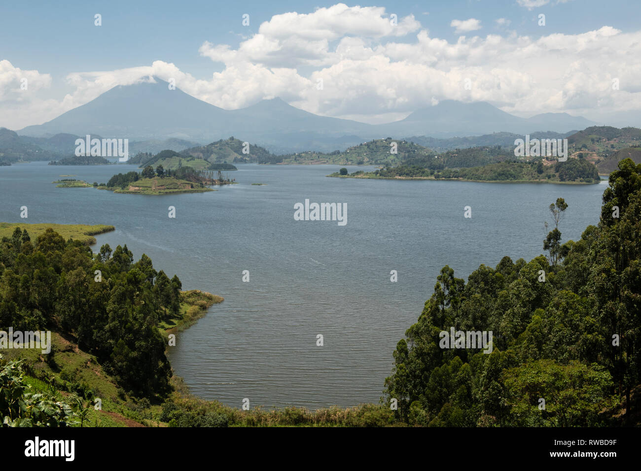 Lake Mutanda with views of volcanoes of the Virunga Mountains, Uganda ...