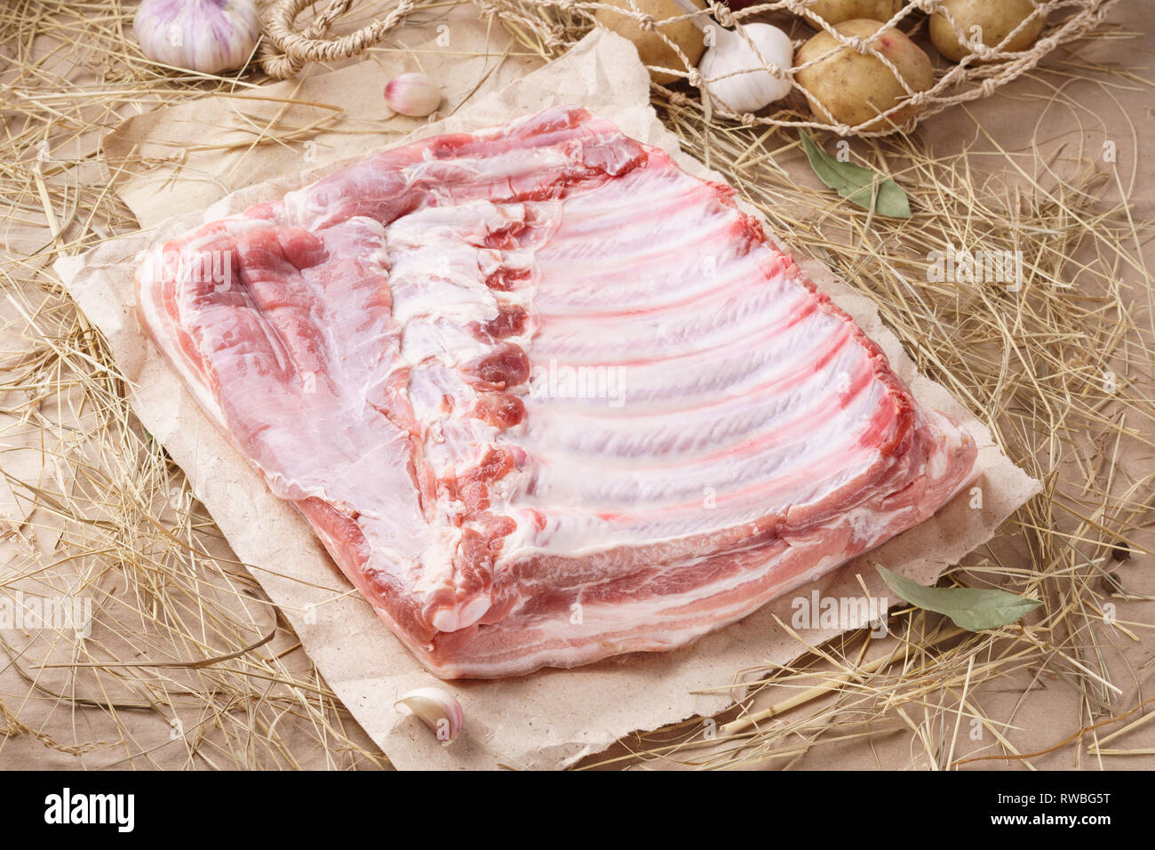 Raw pork meat - spare ribs or belly. Fresh meat and ingredients. Rustic ...