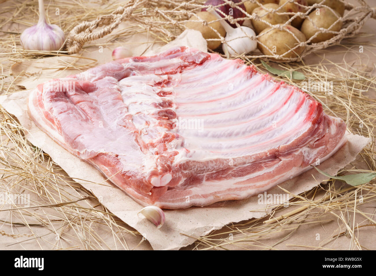 Raw pork meat - spare ribs or belly. Fresh meat and ingredients. Rustic ...