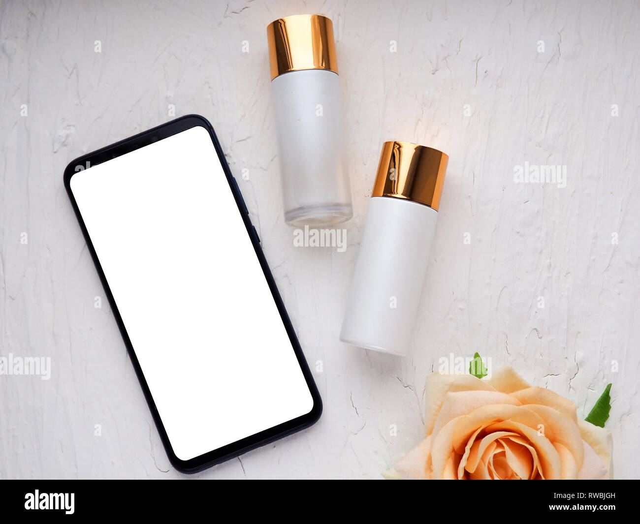 mobile phone with text layout and cosmetic tube, flat lay Stock Photo ...