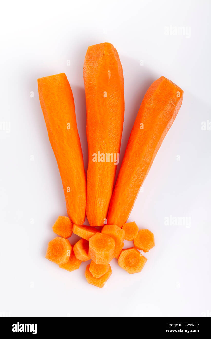 Peeled and cut carrots isolated on white Stock Photo - Alamy