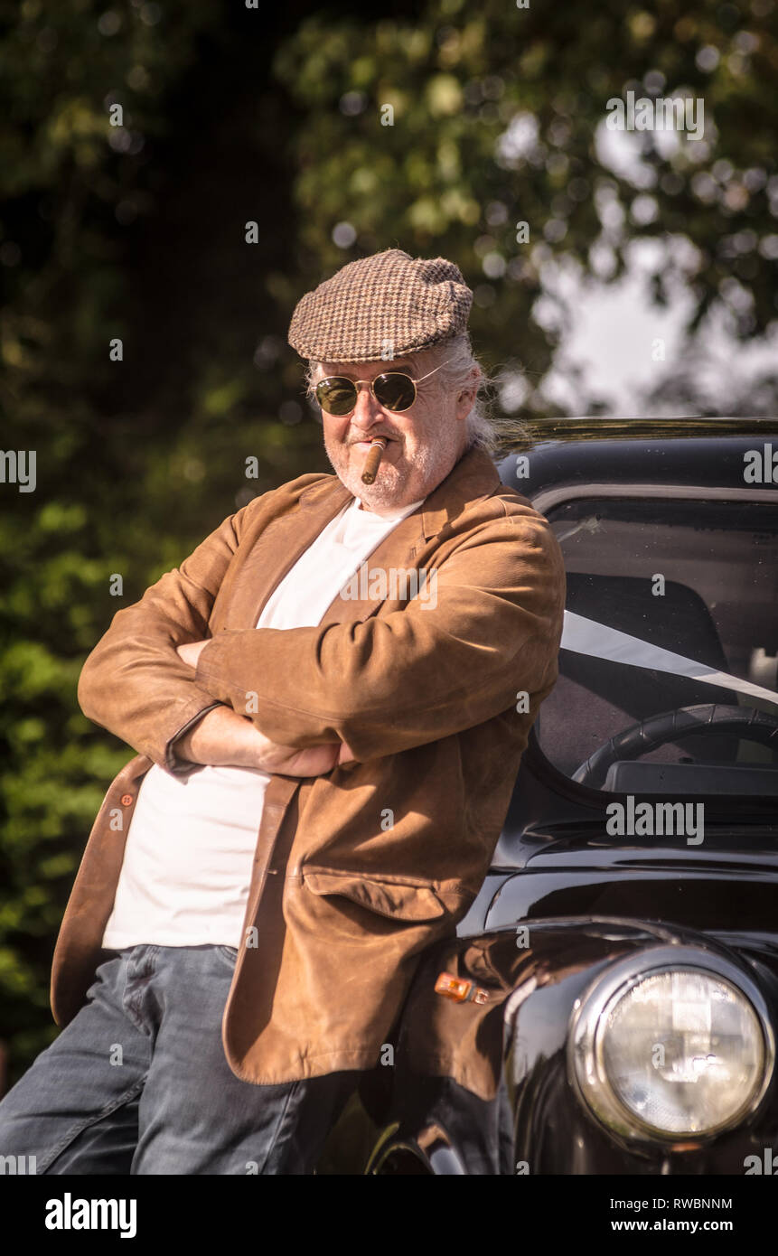Cab driver with cigar by taxi hi-res stock photography and images - Alamy
