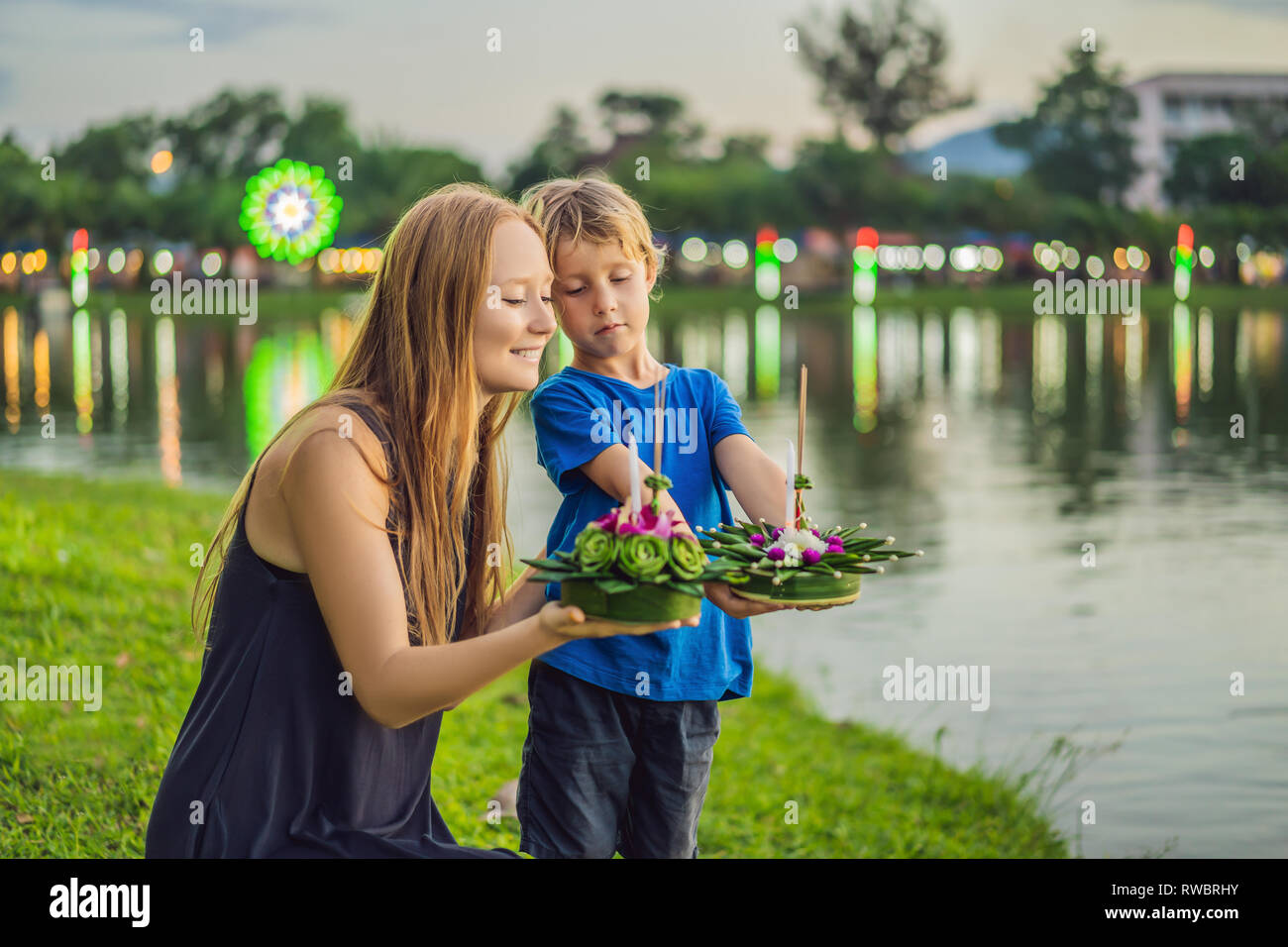 Two boys drink healthy smoothies against the backdrop of palm trees ...