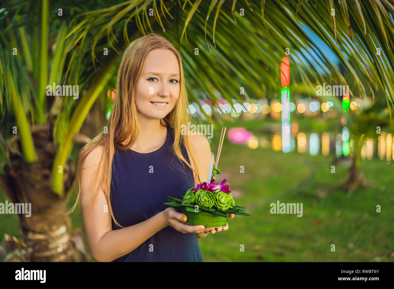 Two boys drink healthy smoothies against the backdrop of palm trees ...