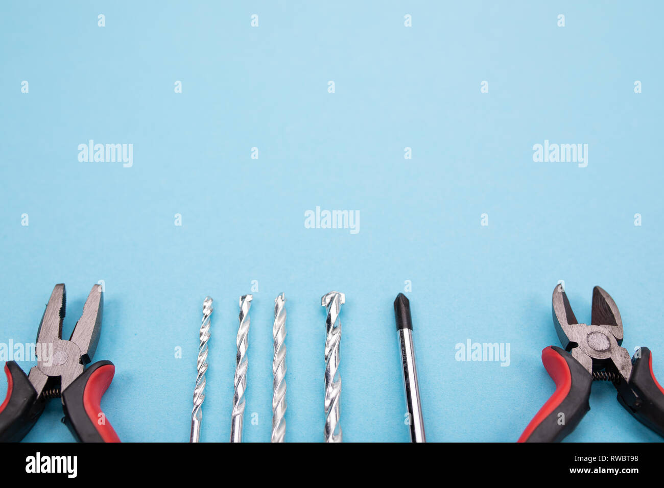 Set of different tools on blue background Stock Photo - Alamy