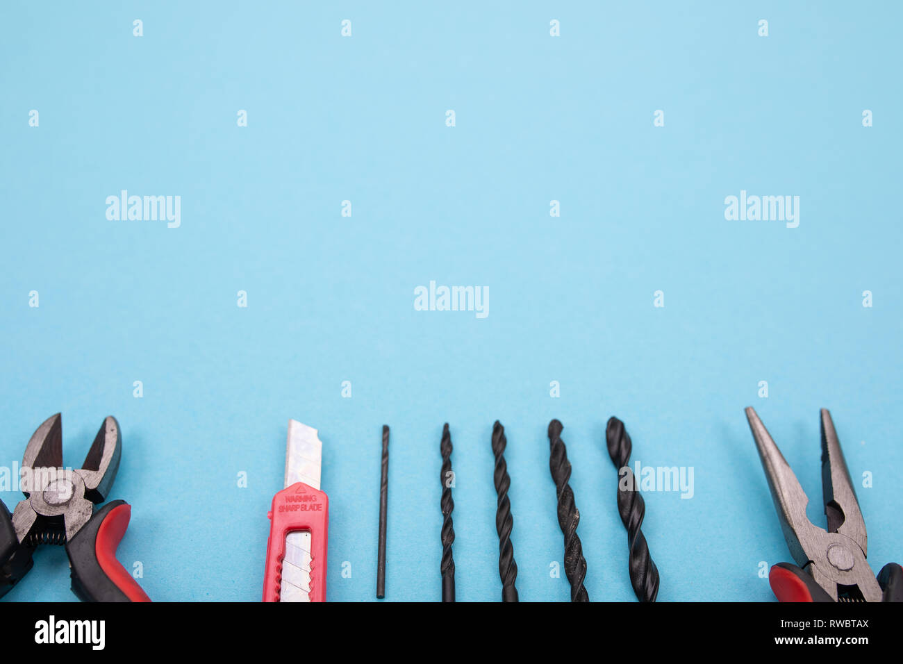 Set of different tools on blue background Stock Photo - Alamy