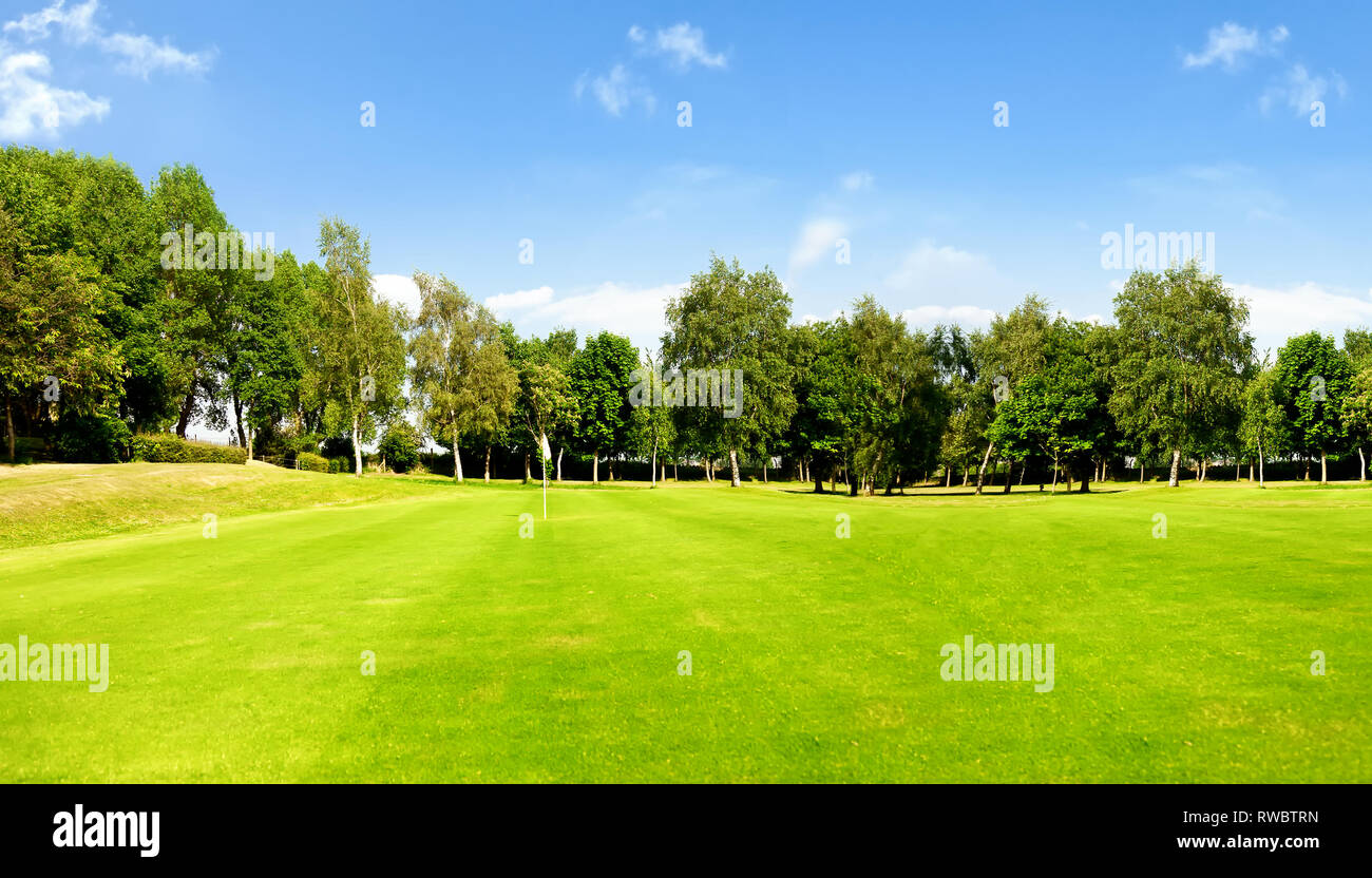 Golf course and blue sky Stock Photo - Alamy