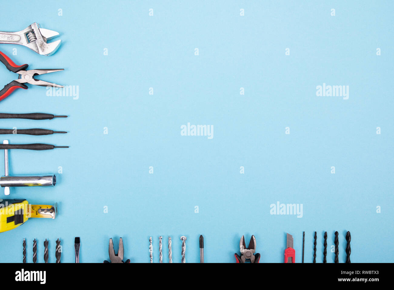 Set of different tools on blue background Stock Photo - Alamy