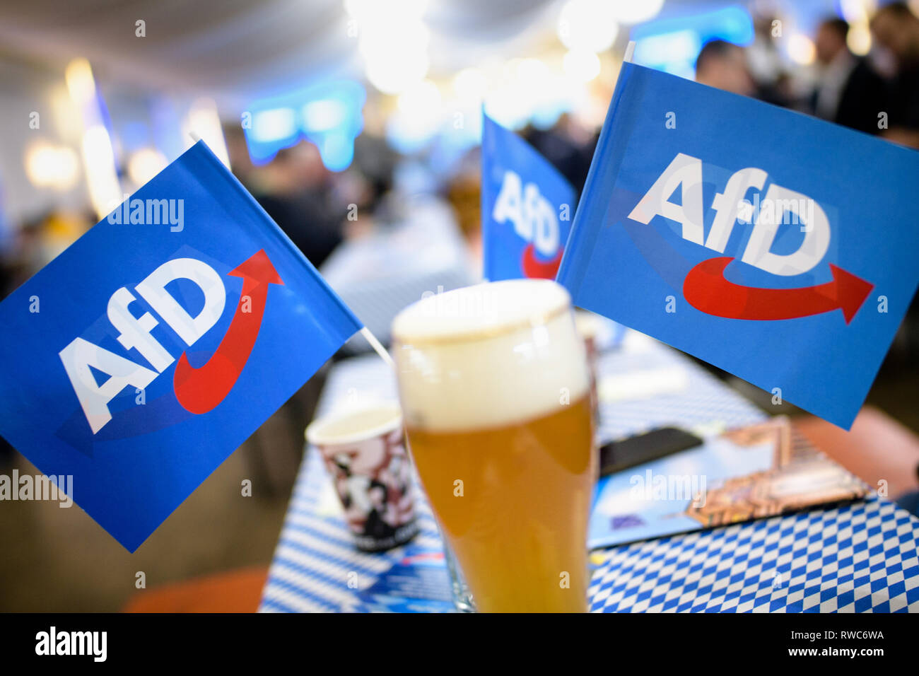 06 March 2019, Bavaria, Osterhofen: AfD flags and beer glasses are on ...