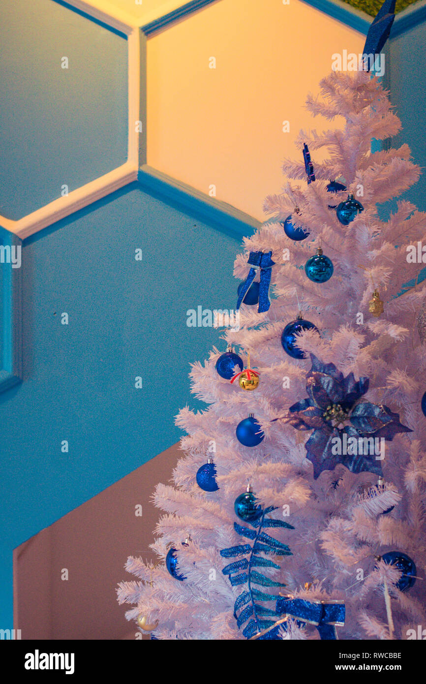 White Christmas tree with blue balls and twinkling lights Stock Photo ...