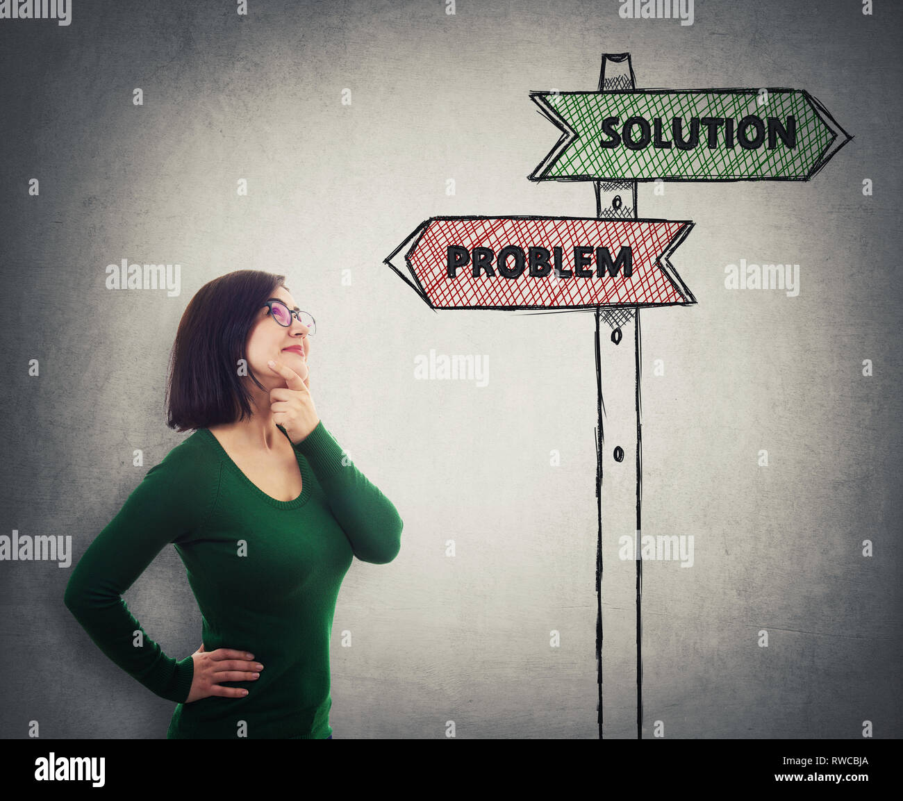 Positive thinking girl holding hand under chin looking up as drawn ...