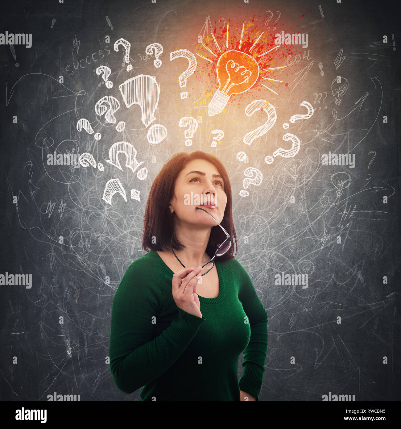 Smart woman meditate looking up thinking of new ideas in front of ...