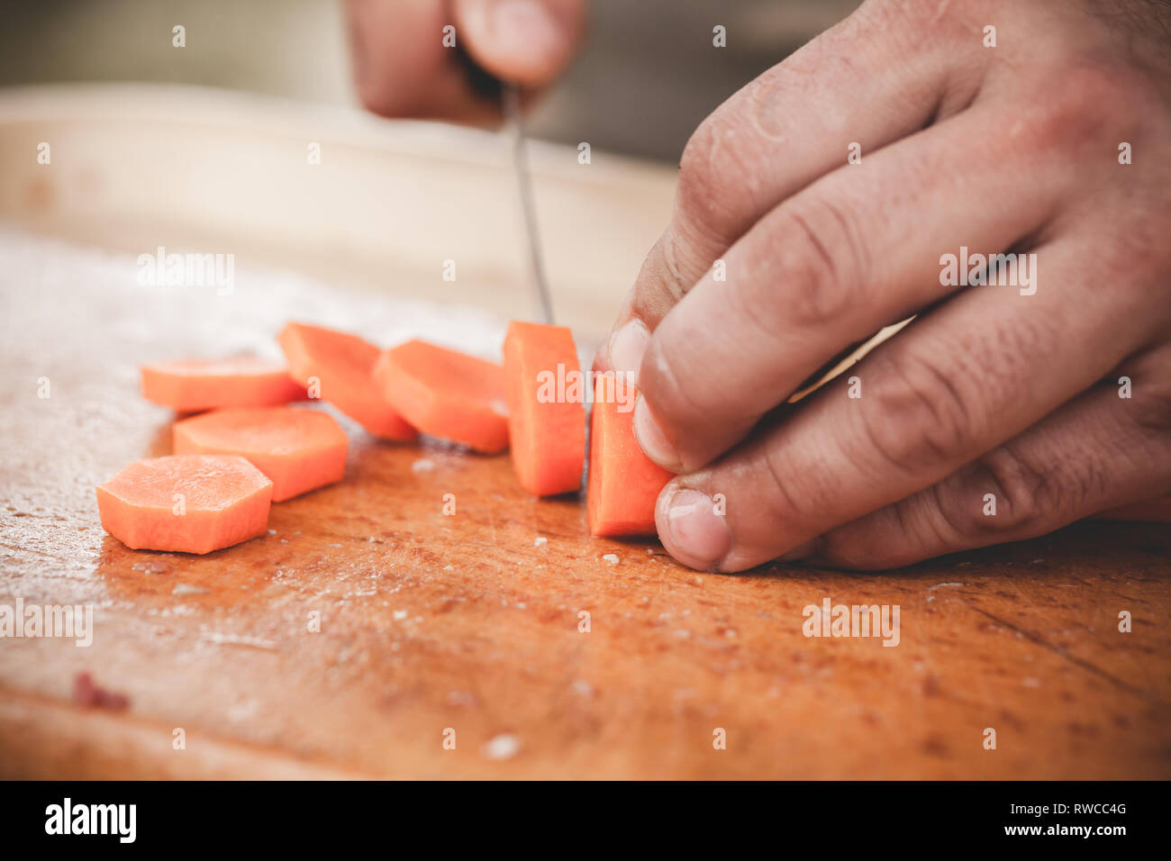 Hand knife cutting carrot hi-res stock photography and images - Alamy