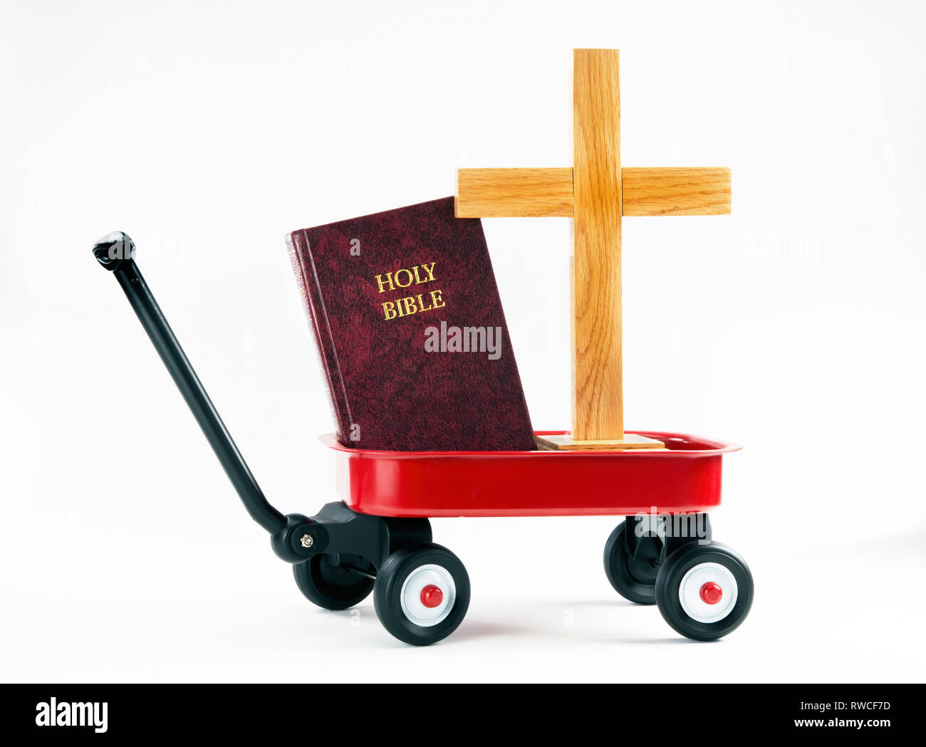 Hauling the old wooden cross and the Holy Bible in a little red wagon ...